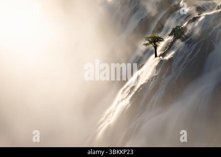 Flood waters of the Kunene River flow over the Ruacana Falls, The ...