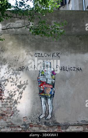lodz poland- człowiek opinia publiczna graffiti on brick wall Stock ...