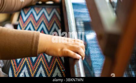 Making tenun ikat Bandar, Indonesia. An Indonesian woman weaving ...