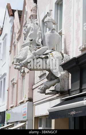 Statue of a mounted knight and the facade of the medieval church of St ...