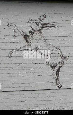 Whimsical Rabbit Mural with Ancient Stone Column on Brick Wall ...