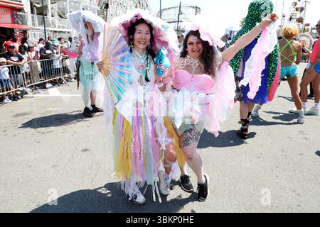 Women dressed mermaids pose for photos before the start of the Mermaid ...