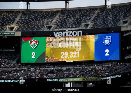 A giant screen displays the attendance of the match during the FIFA ...