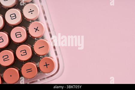Modern calculator on pink background Stock Photo - Alamy