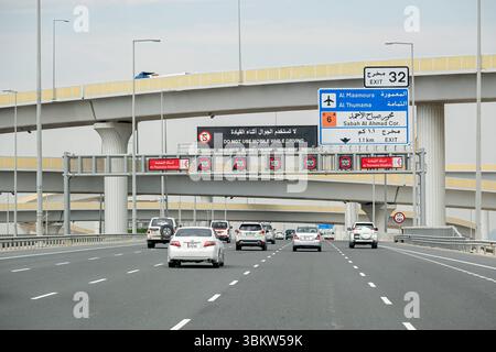 Doha, Qatar - June 22, 2025: Doha Traffic. Roads and sin board on al ...