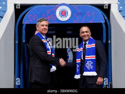 Rangers chairman Andrew Cavenagh (left) watches on during a training ...