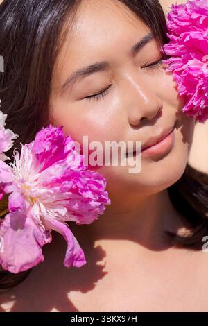 Spring floral aesthetics, wellness or cosmetics concept. Girls hand ...