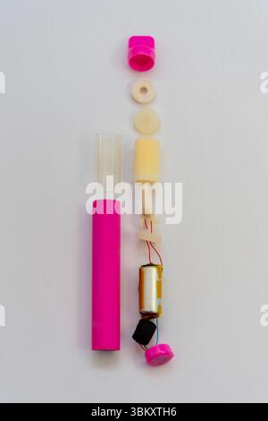 A disassembled vaping device - a view of the electronics, filters and ...