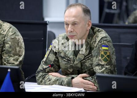 Norway's Defense Minister Tore Sandvik, right, speaks with the media at ...