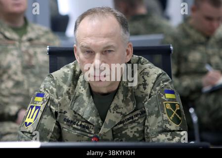Norway's Defense Minister Tore Sandvik, right, speaks with the media at ...