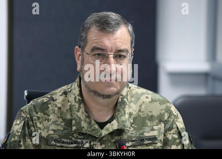 Norway's Defense Minister Tore Sandvik, right, speaks with the media at ...
