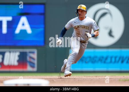 Milwaukee Brewers' Isaac Collins (6) runs to third base on his triple ...