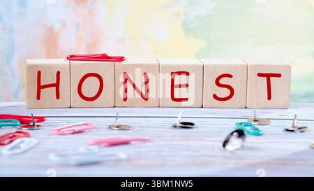 The concept word HONEST is assembled from cubes. Business integrity ...