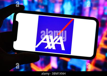 In this photo illustration AXA Group logo seen displayed on a tablet ...