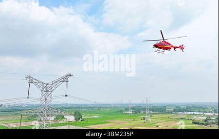 A helicopter is conducting aerial patrol and defect elimination ...