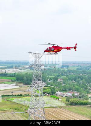 A helicopter is conducting aerial patrol and defect elimination ...