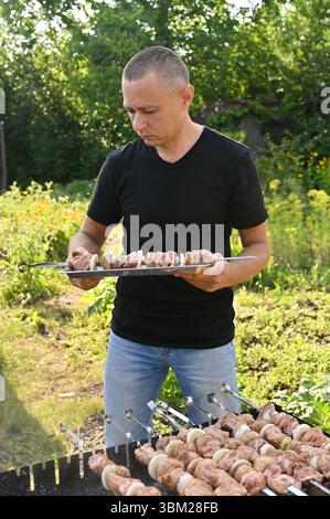 Tasty pork shashlik on the grill Stock Photo - Alamy