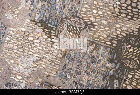 Traditional cobblestone pavement background, smooth river stones ...