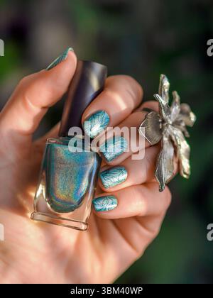 Creative design of nails on female hands. Art manicure Stock Photo - Alamy