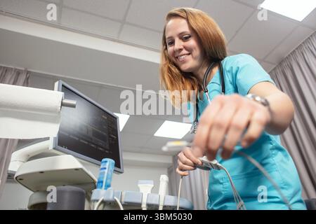 A cardiologist is doing a procedure to check the heart. Cardiologist ...