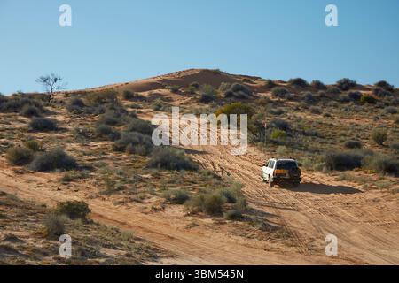 Four wheel drive going up "Big Red" dune, QAA Line, Simpson Desert ...