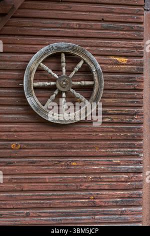 Spinning with a wooden spinning wheel, handicraft detail, thread ...