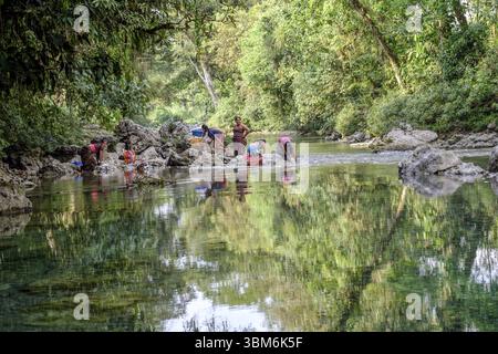 Quiche women washing clothes in the village of Chajul, Quiche province ...