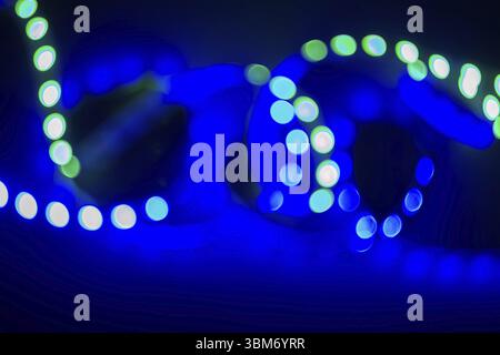 Multicolored blurry bokeh on a green background Stock Photo - Alamy