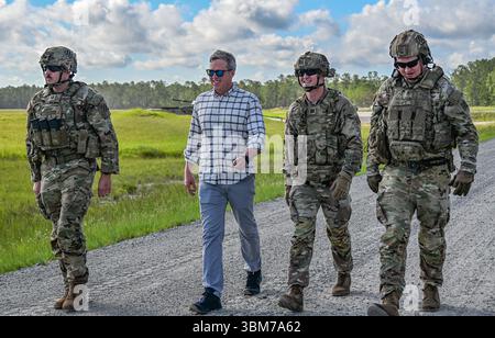 Secretary of the Army Dan Driscoll, in white, talks to U.S. Army ...