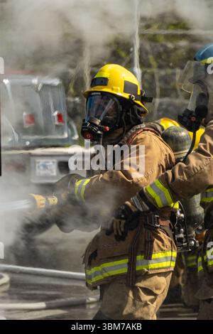 A firefighter with Marine Corps Installations Pacific Fire and ...