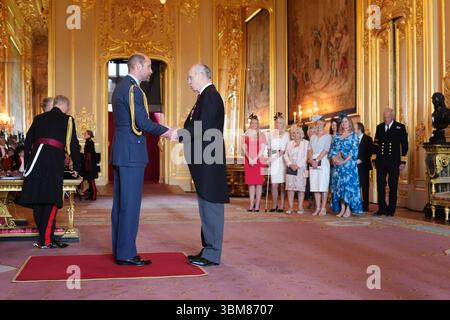 Mr. Kenneth Davy, from Huddersfield, is made an Officer of the Order of ...