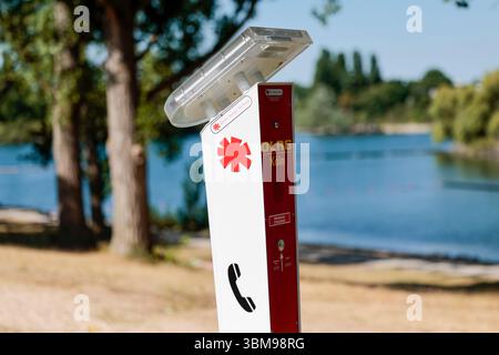 Cologne, Germany. 25th June, 2025. An emergency call pillar of the DLRG ...