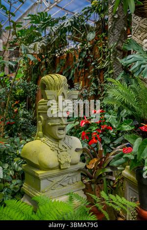 An Aztec Stone Sculpture in a greenhouse at the Vallarta Botanical ...