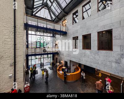 Chester Beatty Library interior atrium with reception desk and visitors ...