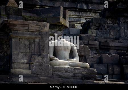 Headless stone Buddha statue among brick ruins in Ayutthaya Stock Photo ...