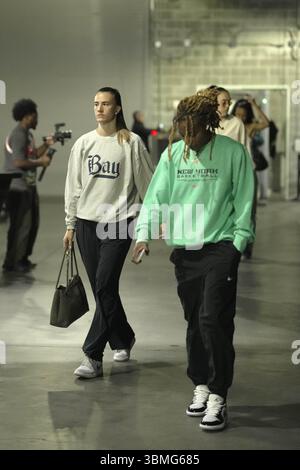 New York Liberty guard Sabrina Ionescu (20) walking on the court with a ...
