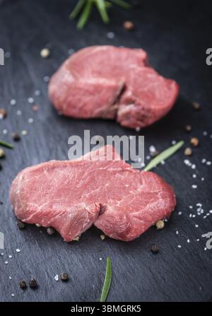 Slate slab with raw Beef Fillet Stock Photo - Alamy
