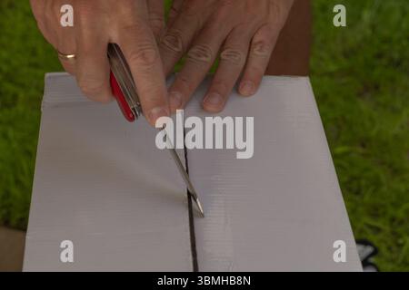 Business and finance. A man holds a cardboard in his hand on which it ...