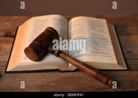 Holy Bible with judge's gavel on dark wooden background Stock Photo - Alamy