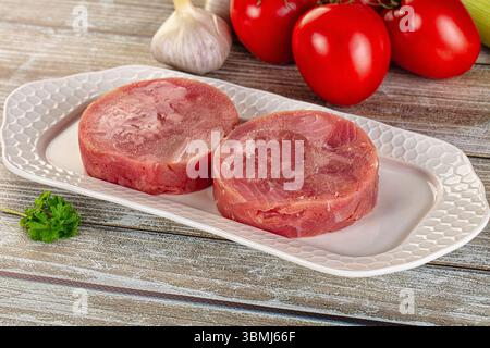 Raw round tuna fish uncucked fillet Stock Photo - Alamy