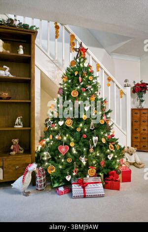 Christmas tree with decorations in a rustic style and garlands on a ...