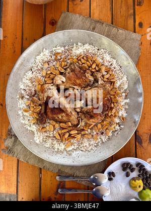 Chickpeas hummus with olive oil and toasted sesame on dark background ...