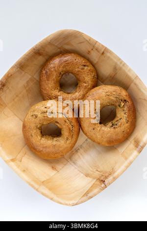Bagels in wooden bowl on white background, isolated Stock Photo - Alamy