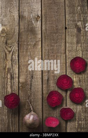 sliced beetroot on slate and wooden counter top background Stock Photo ...