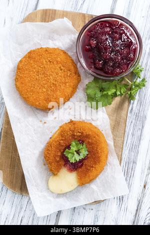 Fresh made Fried Camembert (selective focus) on wooden background Stock ...