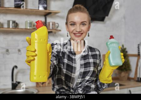 woman comparing two detergent products Stock Photo - Alamy