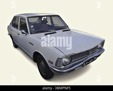 Classic white Toyota Corolla car parked on a seamless white background ...