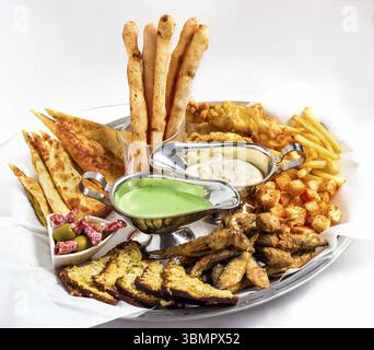 Large plate with a wide selection of snacks for beer served with two ...