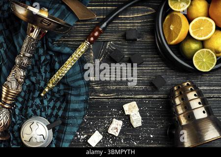 Stylish Smoking hookah and basket with lemon, lime and orange on Stock ...