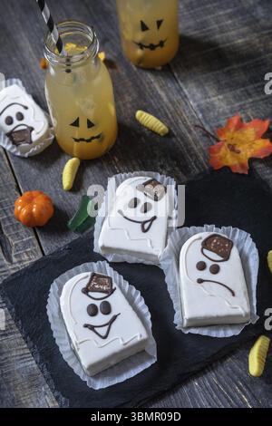 Sweets for halloween party. Funny homemade Halloween cupcakes on modern ...